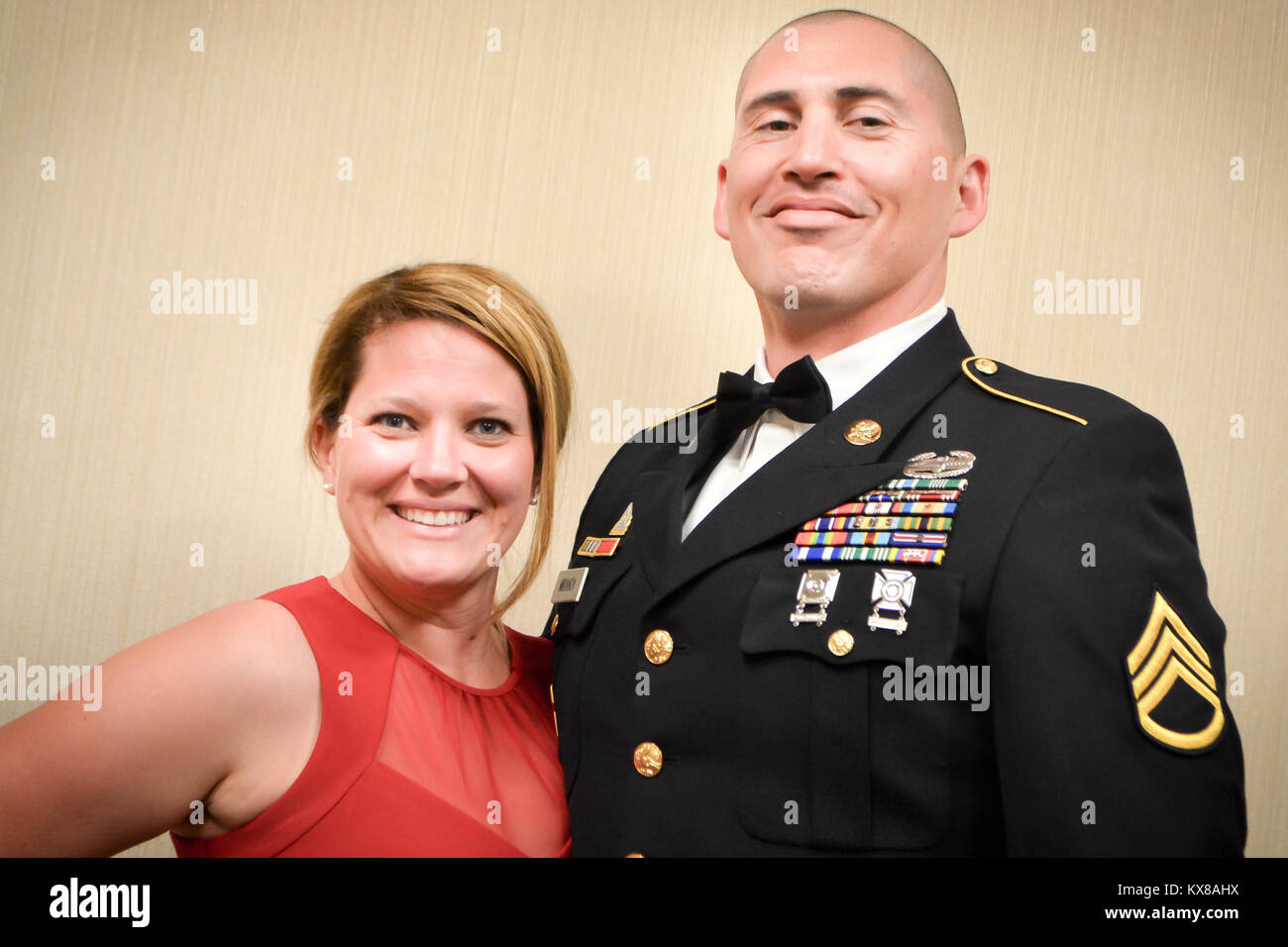 US military National Guard personnel with family and partners at awards ...