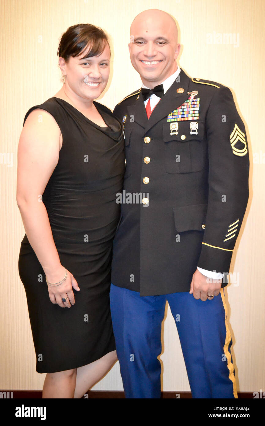 US military National Guard personnel with family and partners at awards ...