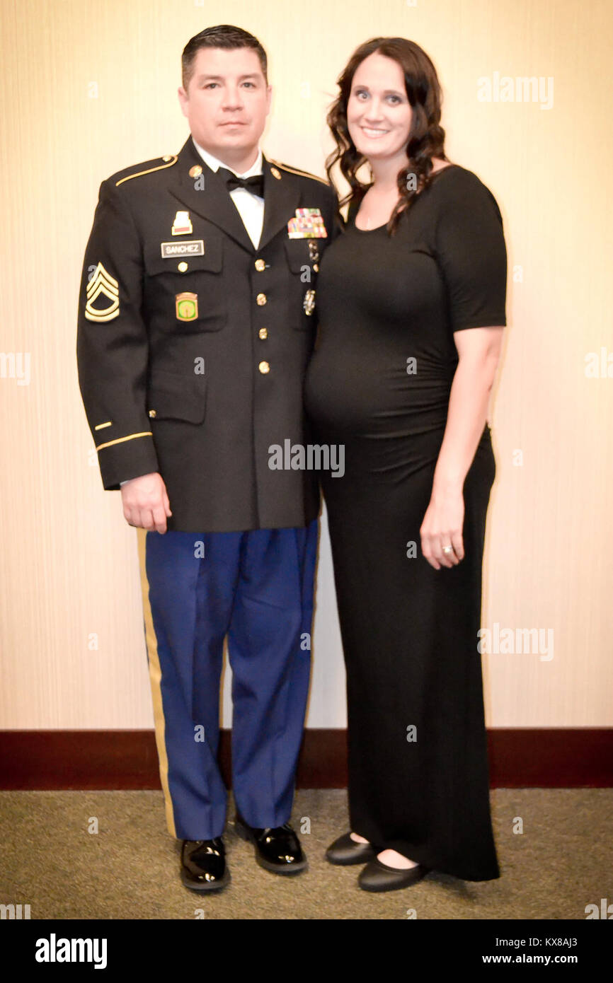US military National Guard personnel with family and partners at awards ...