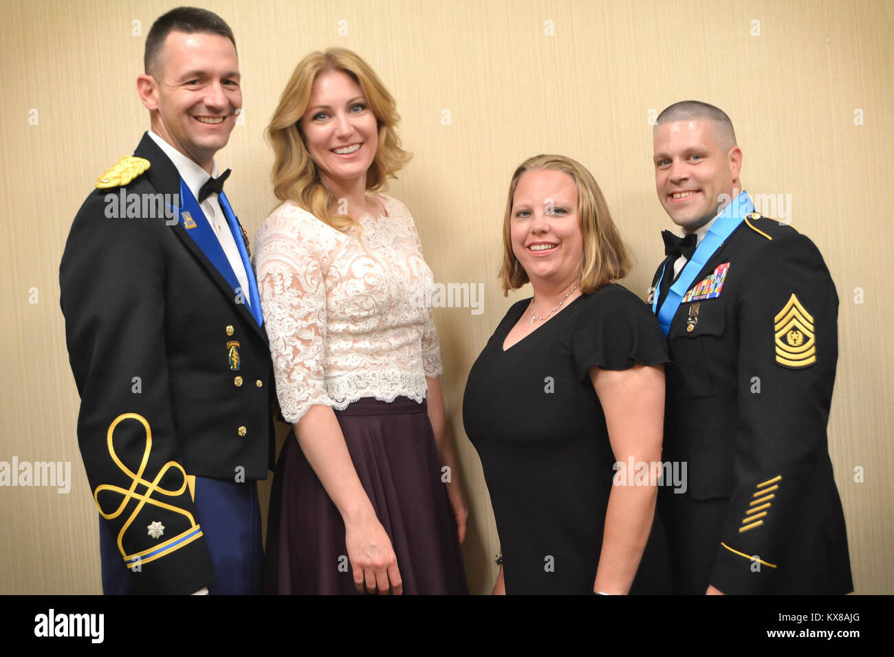 US military National Guard personnel with family and partners at awards ...