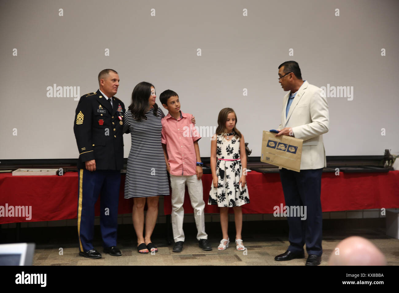 US military National Guard personnel with family and partners at awards ...