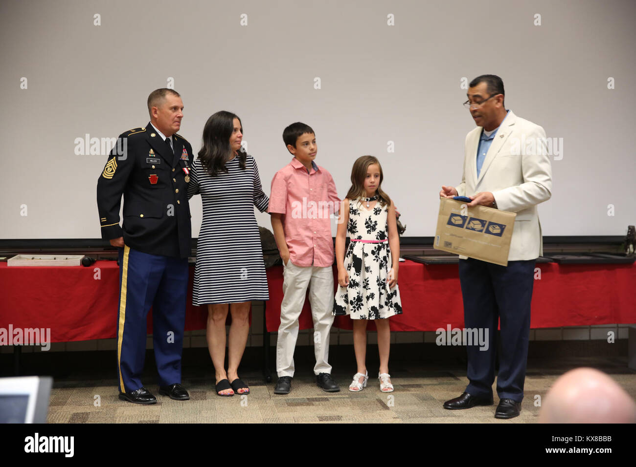US military National Guard personnel with family and partners at awards ...