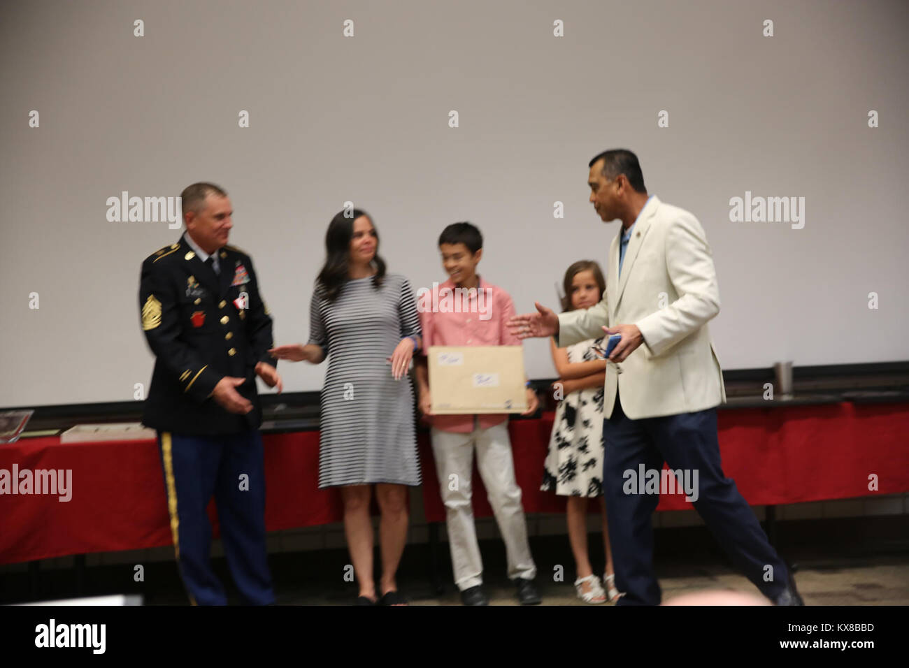 US military National Guard personnel with family and partners at awards ...