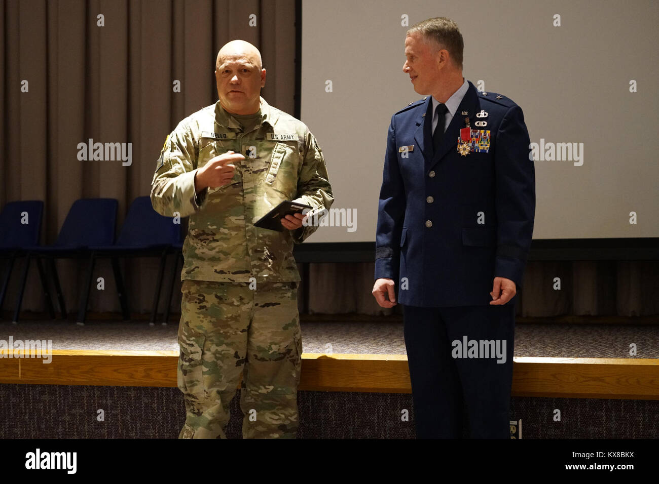US military National Guard personnel with family and partners at awards ...