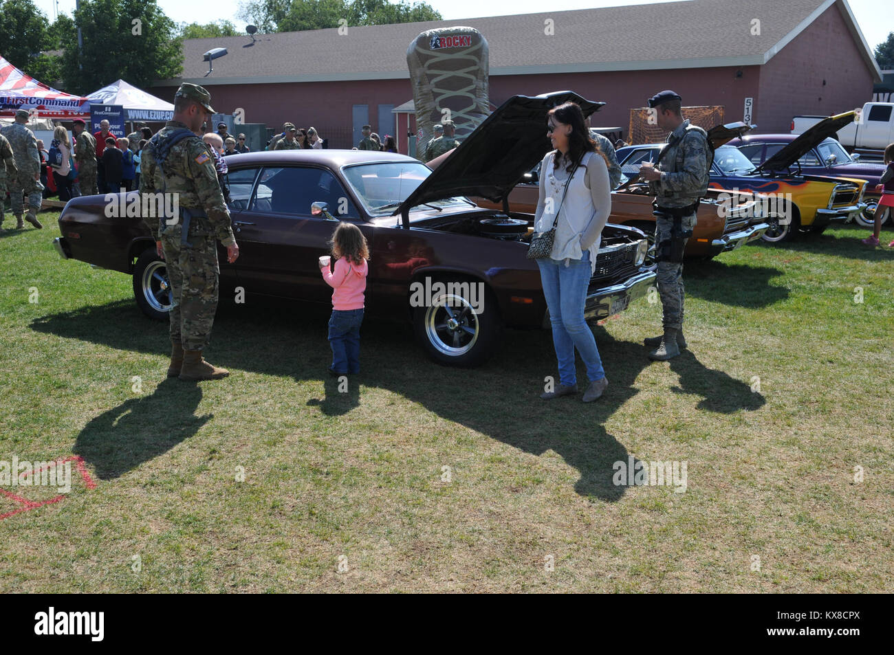 US Army National Guard meet with vintage muscle car enthusiasts Stock ...