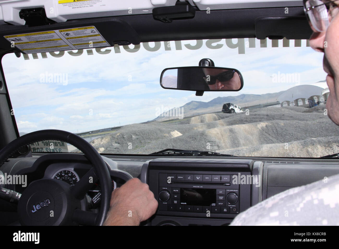 US Army National Guard off road driving in civilian Jeep Stock Photo ...