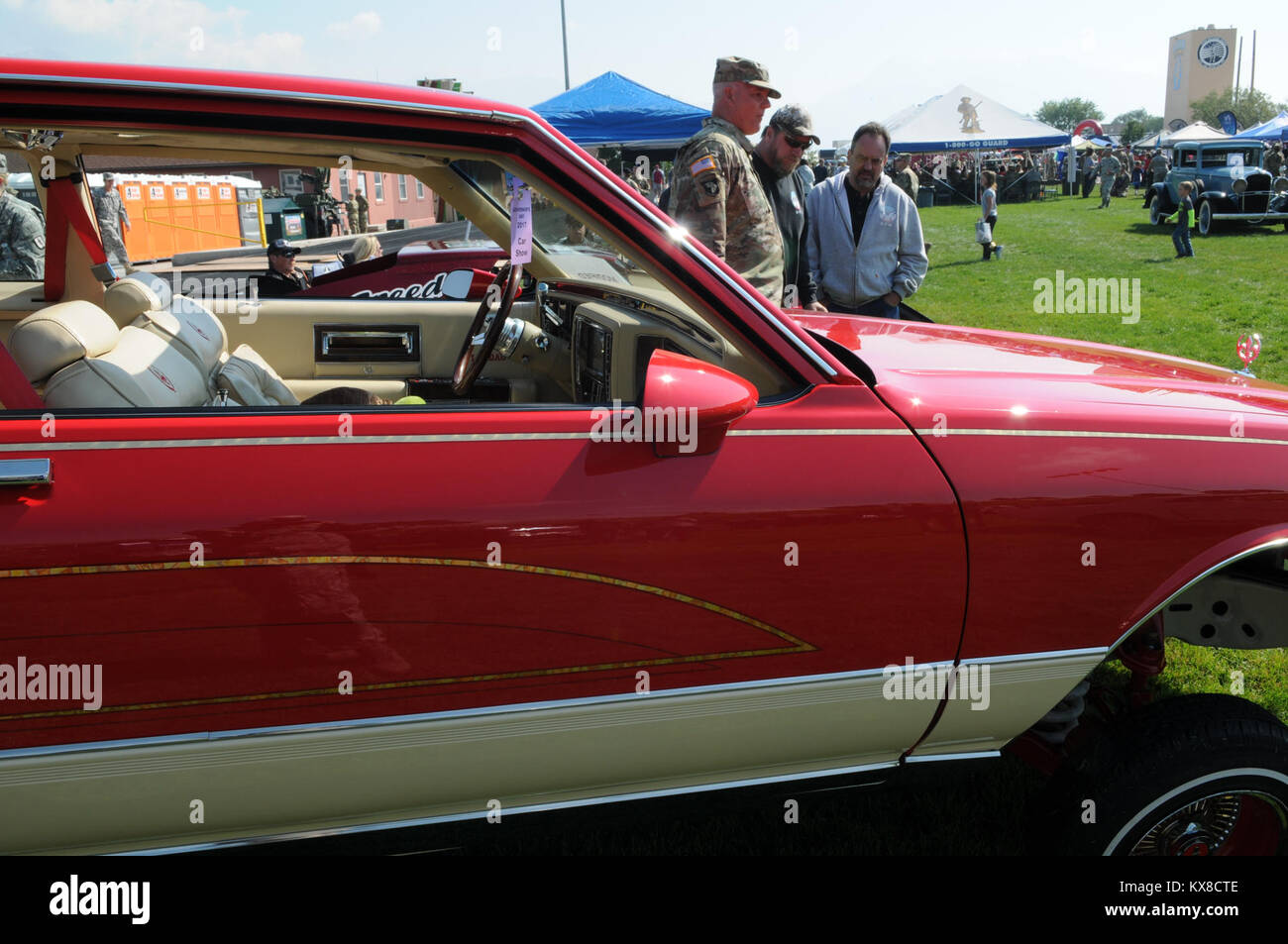 US Army National Guard meet with vintage muscle car enthusiasts Stock ...