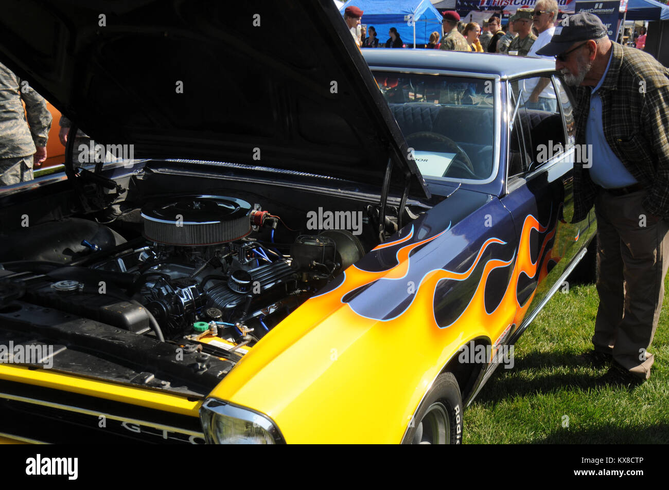 US Army National Guard meet with vintage muscle car enthusiasts Stock ...
