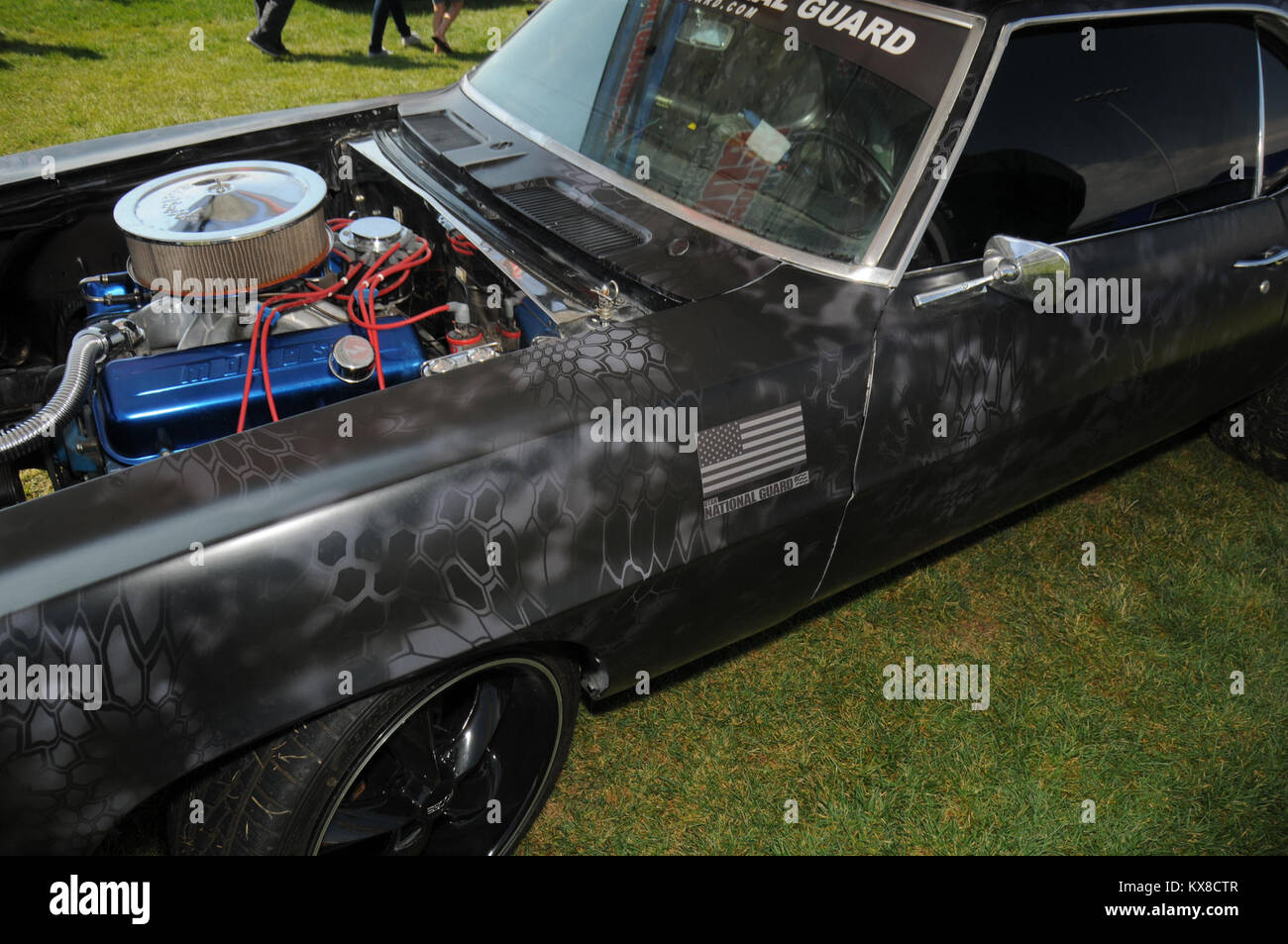 US Army National Guard meet with vintage muscle car enthusiasts Stock ...