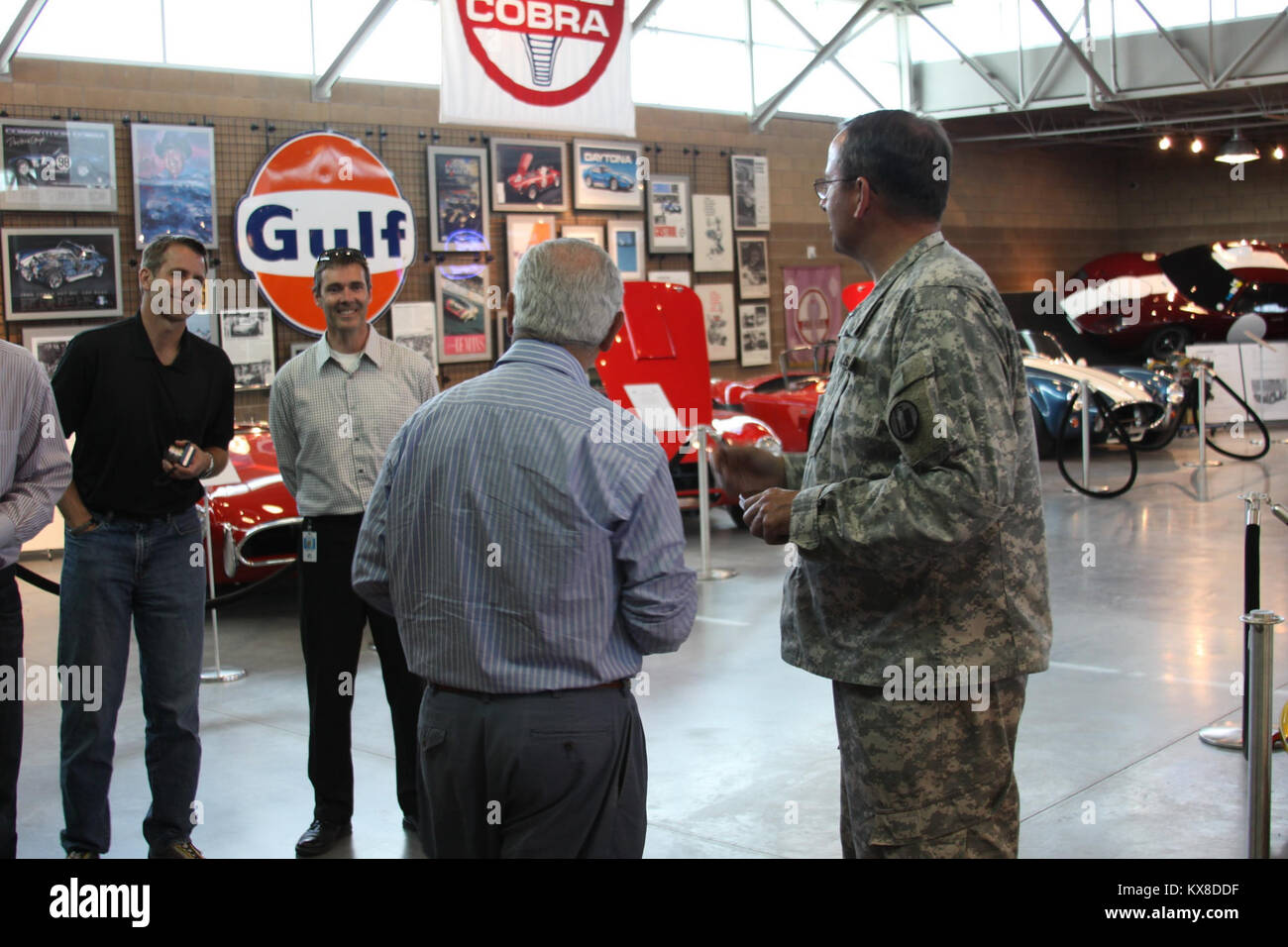 US Army National Guard meet with vintage muscle car enthusiasts Stock ...