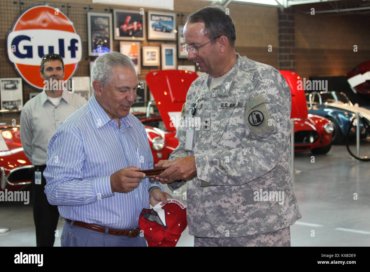 US Army National Guard meet with vintage muscle car enthusiasts Stock ...