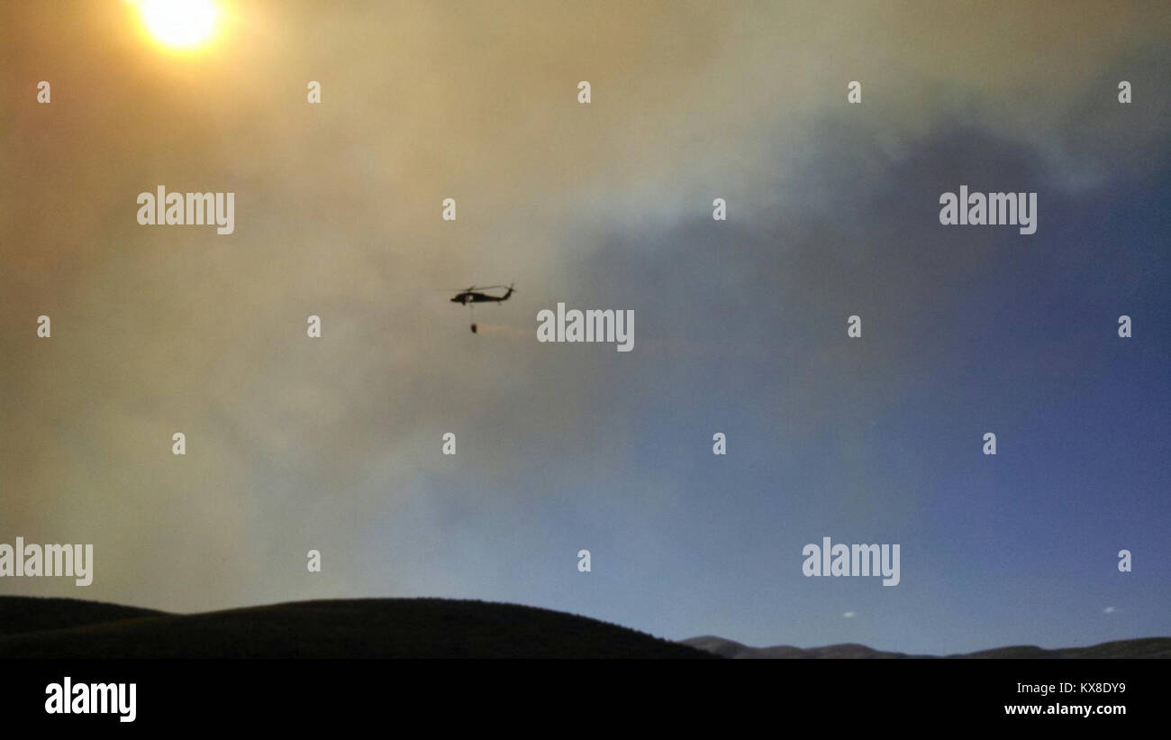 US National Guard helicopter water bomber fighting wildfires Stock ...