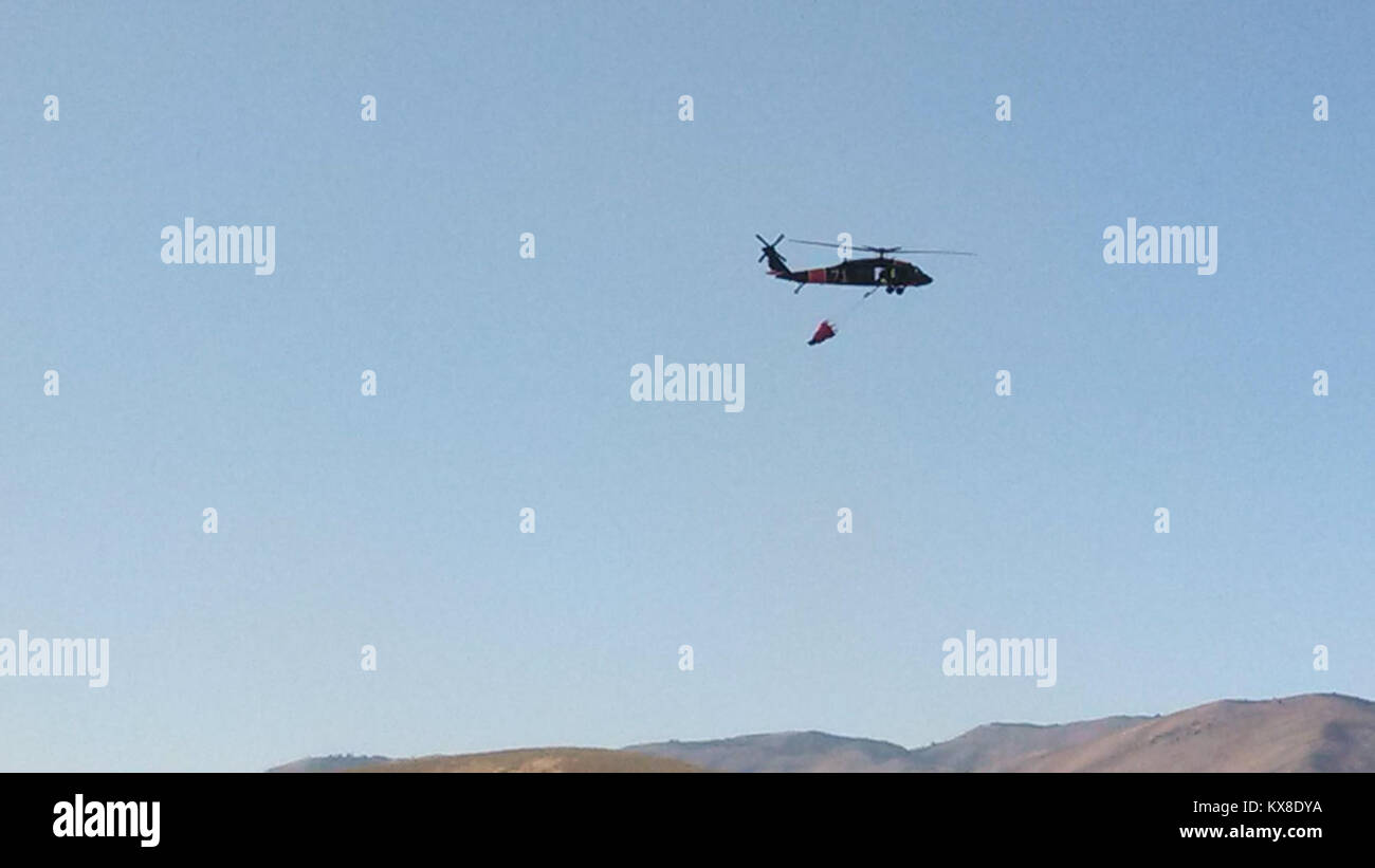 US National Guard helicopter water bomber fighting wildfires Stock ...