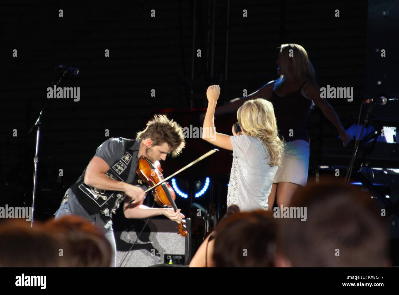 Woman singer on stage concert Stock Photo - Alamy