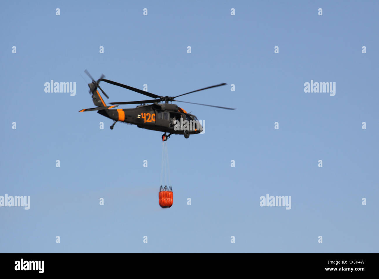 US military national guard helicopters practice water drop Stock Photo ...