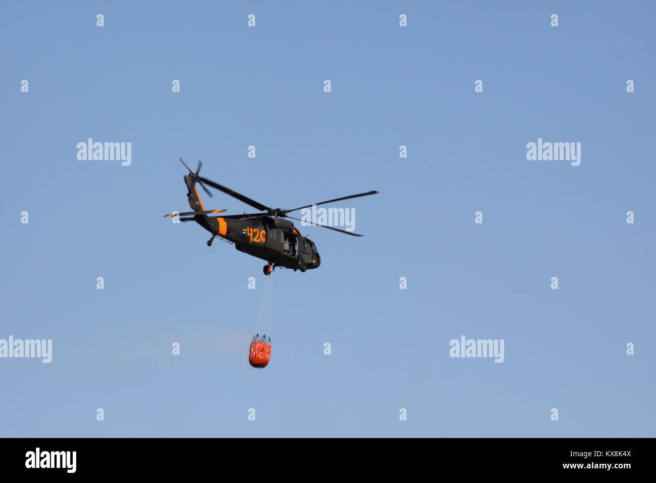 US military national guard helicopters practice water drop Stock Photo ...