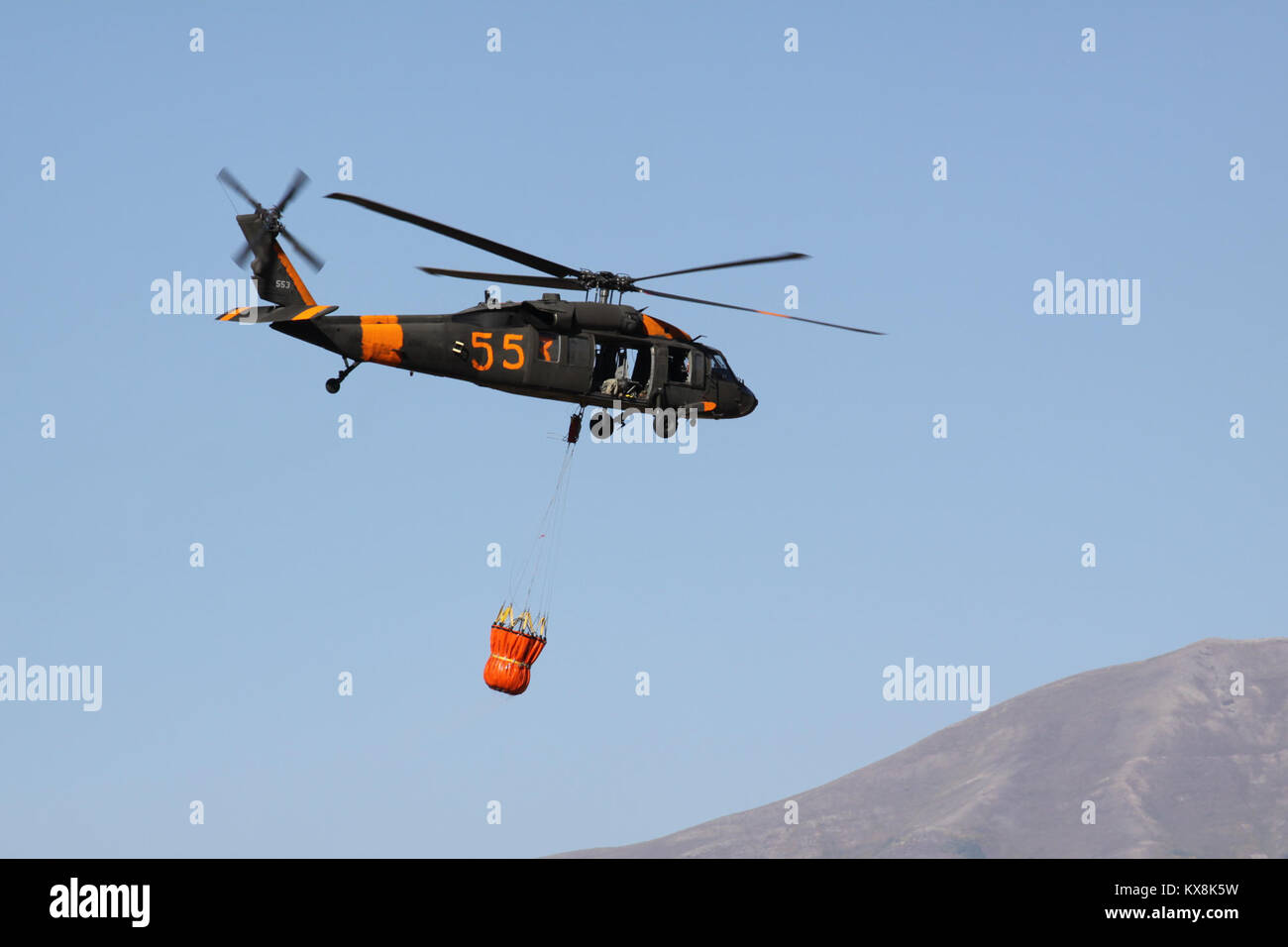US military national guard helicopters practice water drop Stock Photo ...