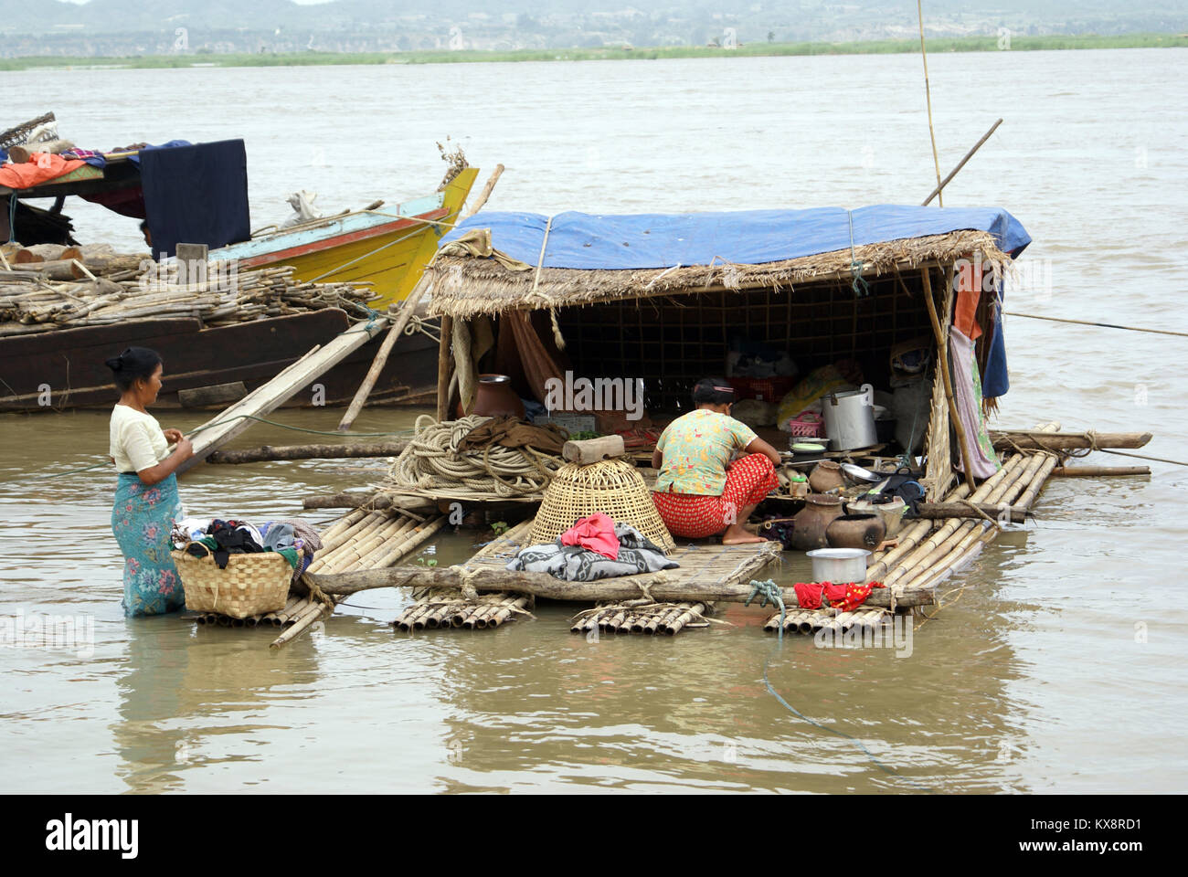Women and houseboat on the river in Mandalay, Myanmar Stock Photo - Alamy