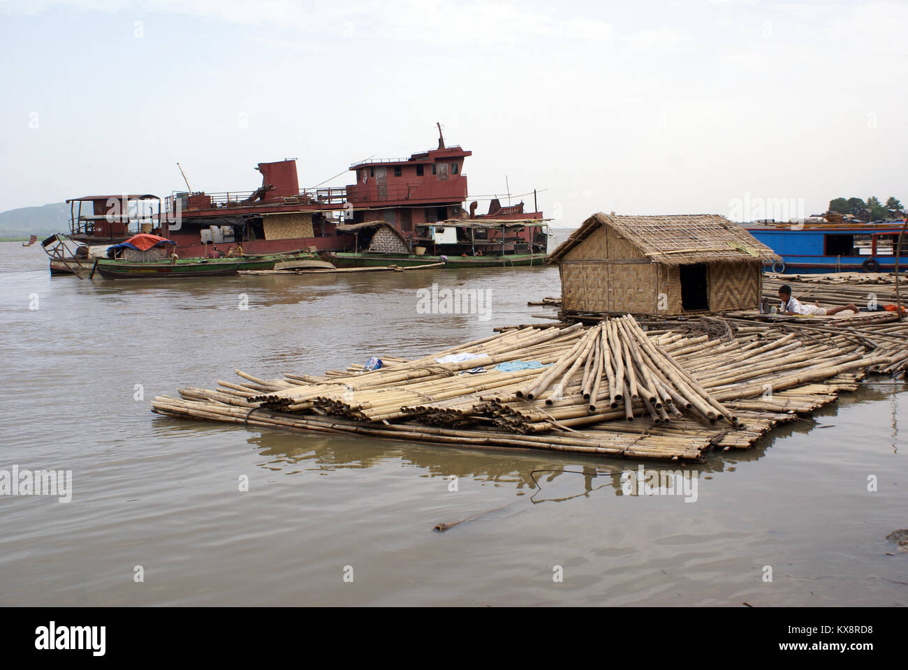 Houseboat and red ship on the river in Mandalay, Myanmar Stock Photo ...