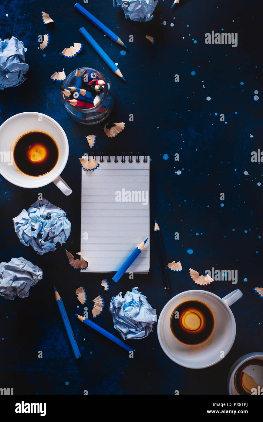 Creative writing concept with linded note paper, empty coffee cups ...