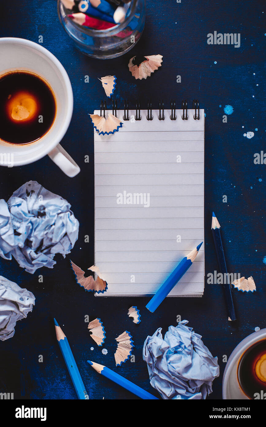 Creative writing concept with linded note paper, empty coffee cups ...
