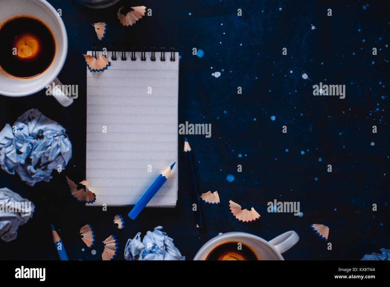 Creative writing concept with linded note paper, empty coffee cups ...