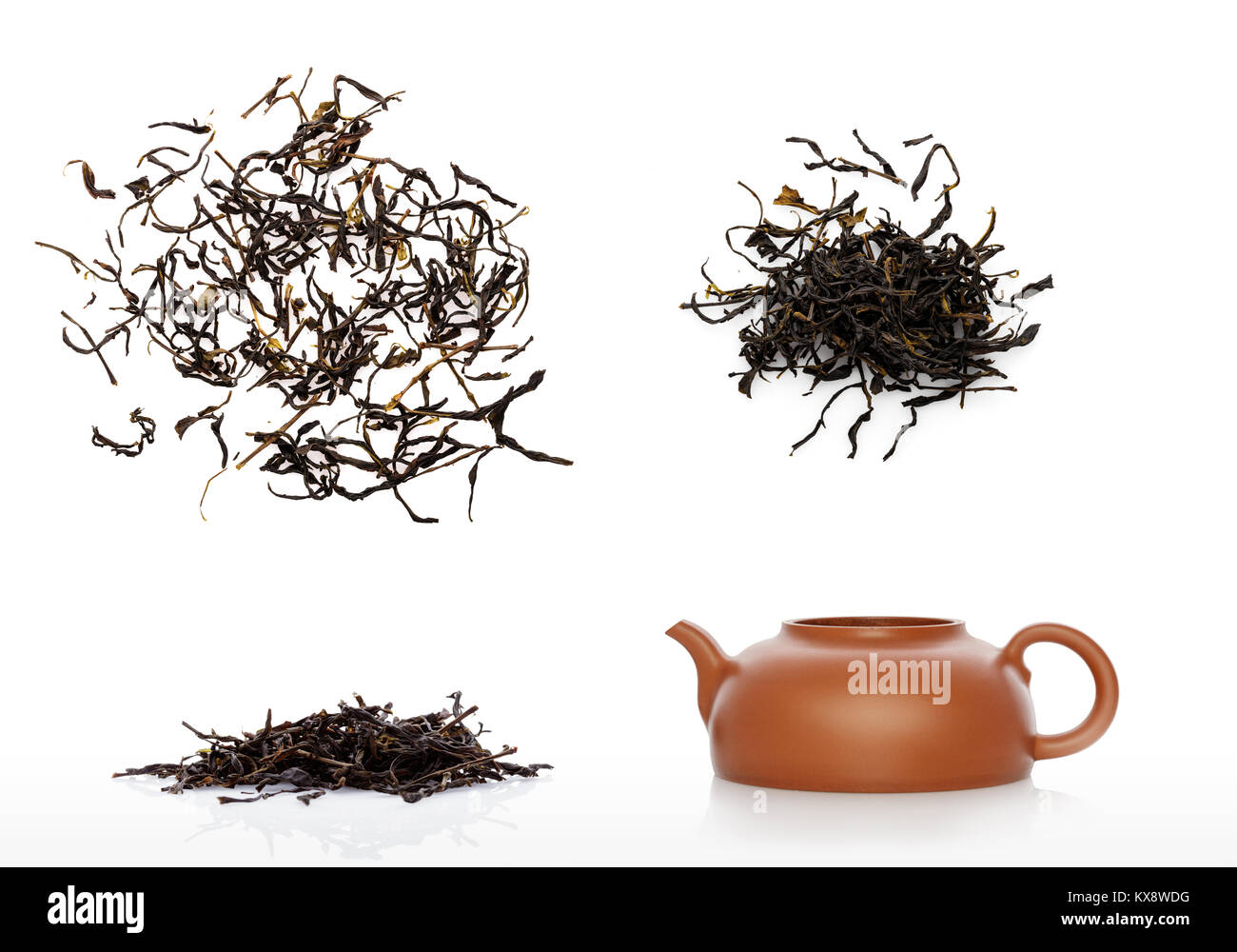 Tea pot and pile of raw chinese tea isolated on white Stock Photo - Alamy