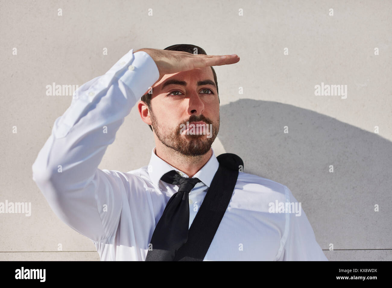 Young businessman as founder looks into the distance and has a vision ...