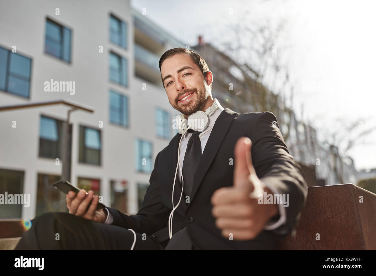 Successful business man as start-up founder with thumbs up Stock Photo ...