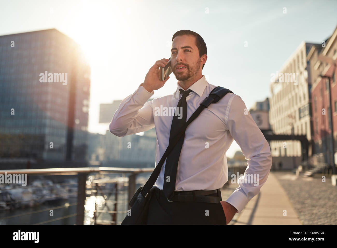 Dynamic businessman makes phone call with smartphone Stock Photo - Alamy