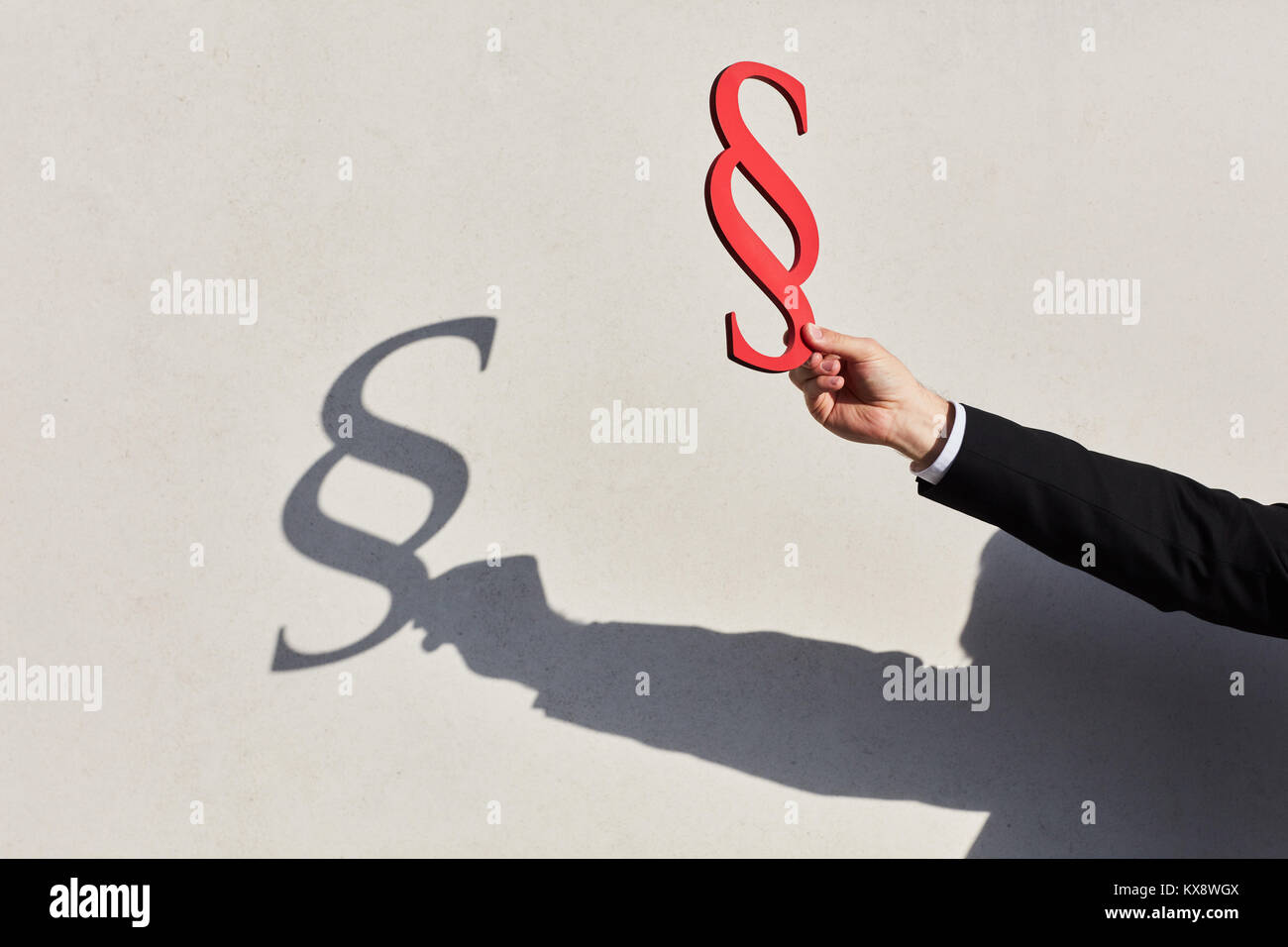 Hand holds paragraphs as a symbol for balancing between pros and cons ...