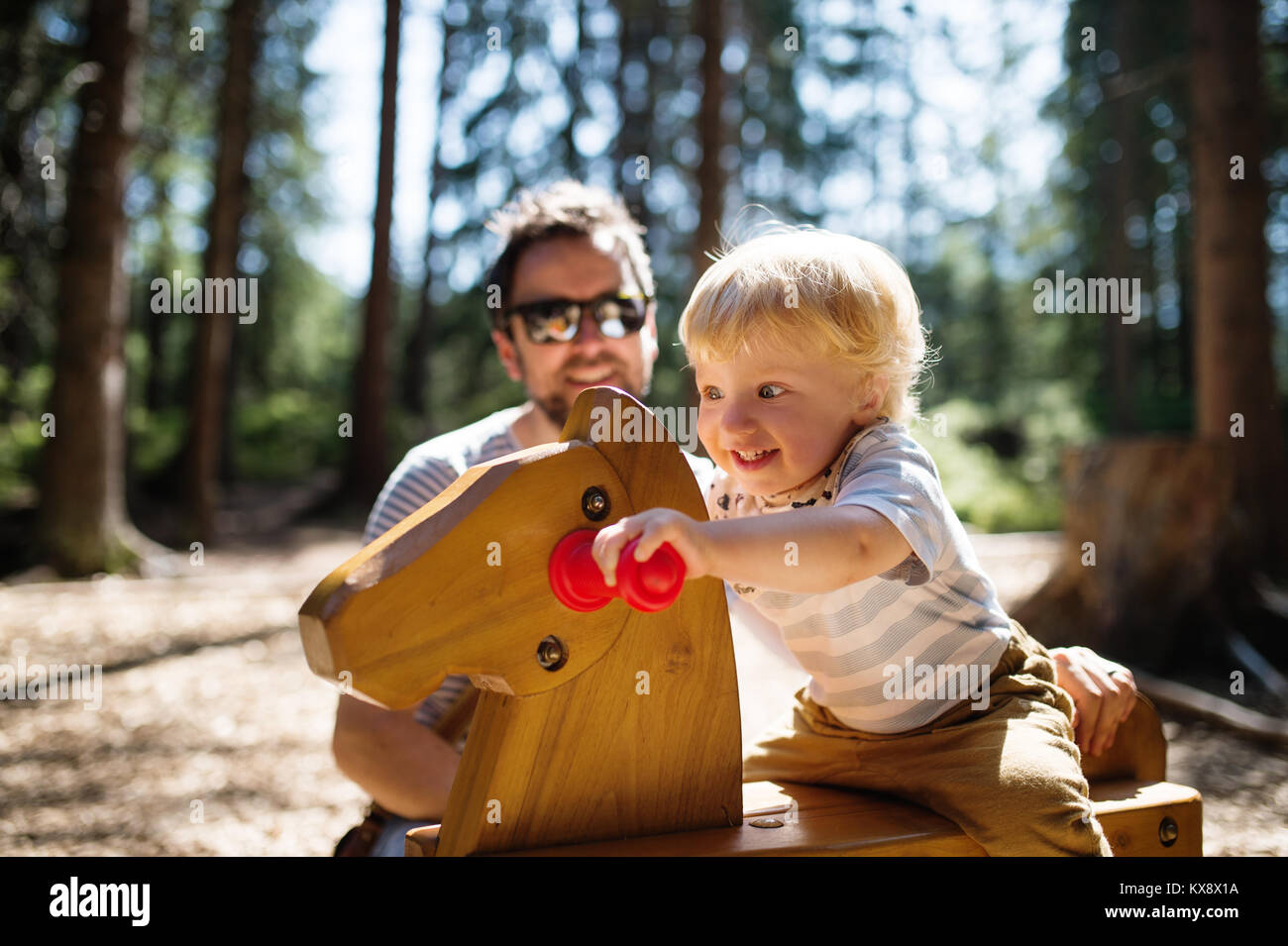 Father with little boy on the playground Stock Photo - Alamy