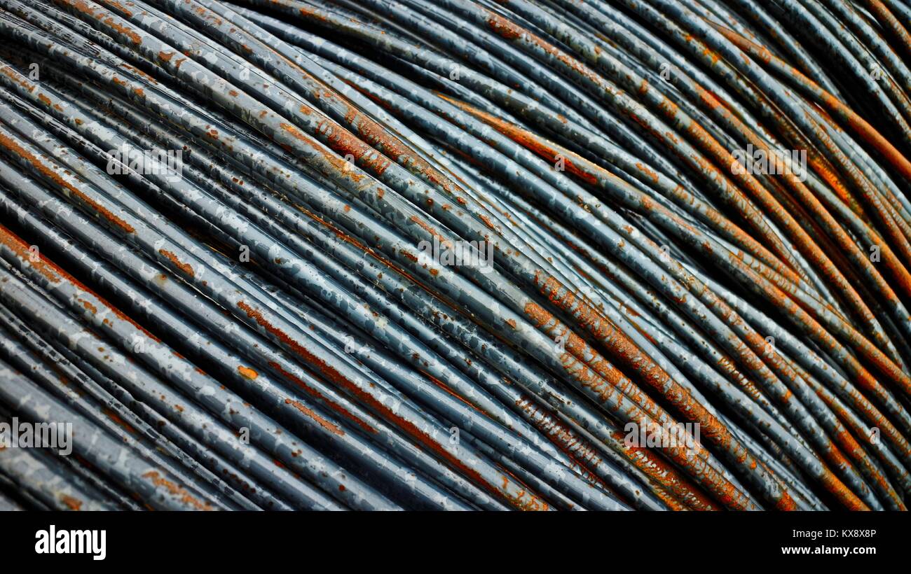 Coiled rusty steel rod wire close up Stock Photo - Alamy