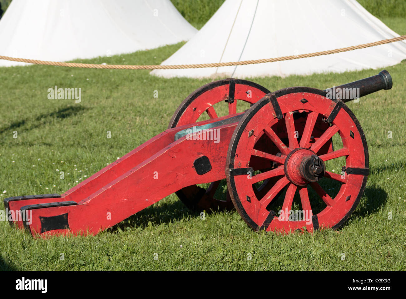 Antique Medieval Red Metallic Cannon on Wheels Stock Photo - Alamy