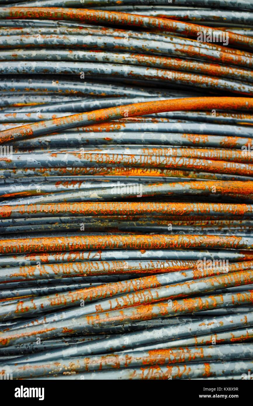 Coiled rusty steel rod wire close up Stock Photo - Alamy