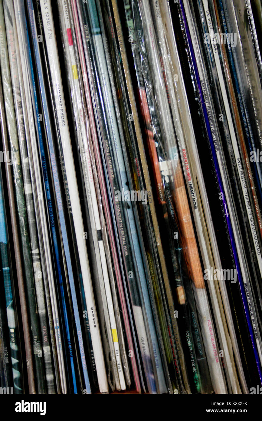 Vinyl albums stacked vertically in a unit Stock Photo - Alamy