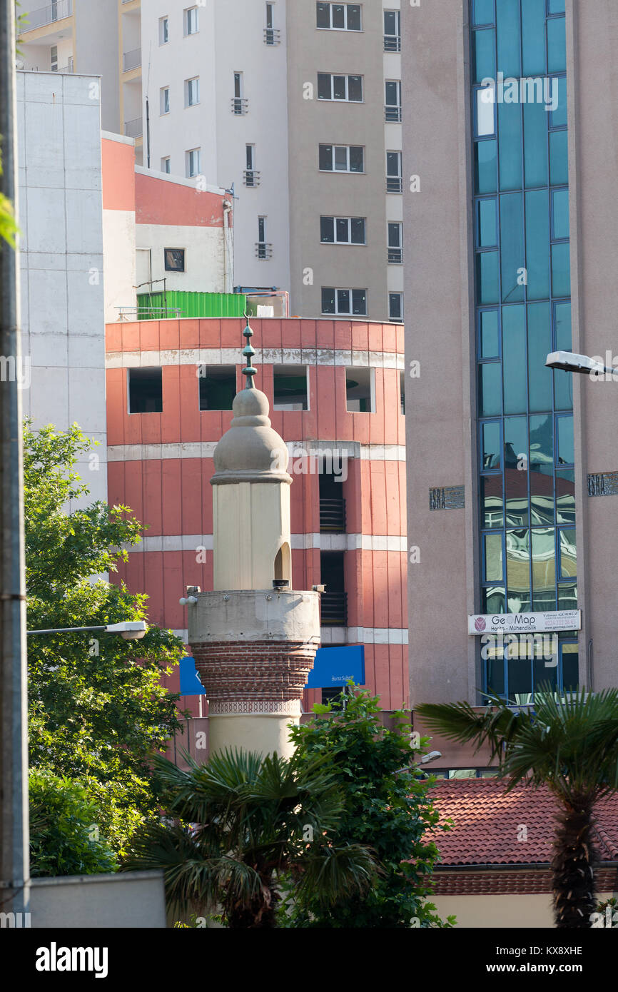 Civilization changes. The minaret domineered by skyscrapers Stock Photo ...