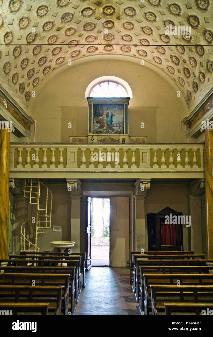 exit of the church with open part and organ with painted wooden ...