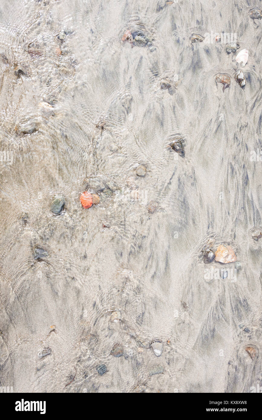 Sand beach and small stones Stock Photo - Alamy