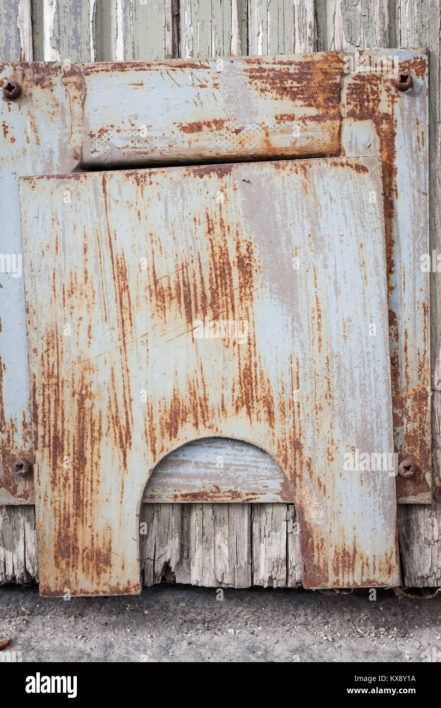 Small rusty hatch in door Stock Photo - Alamy