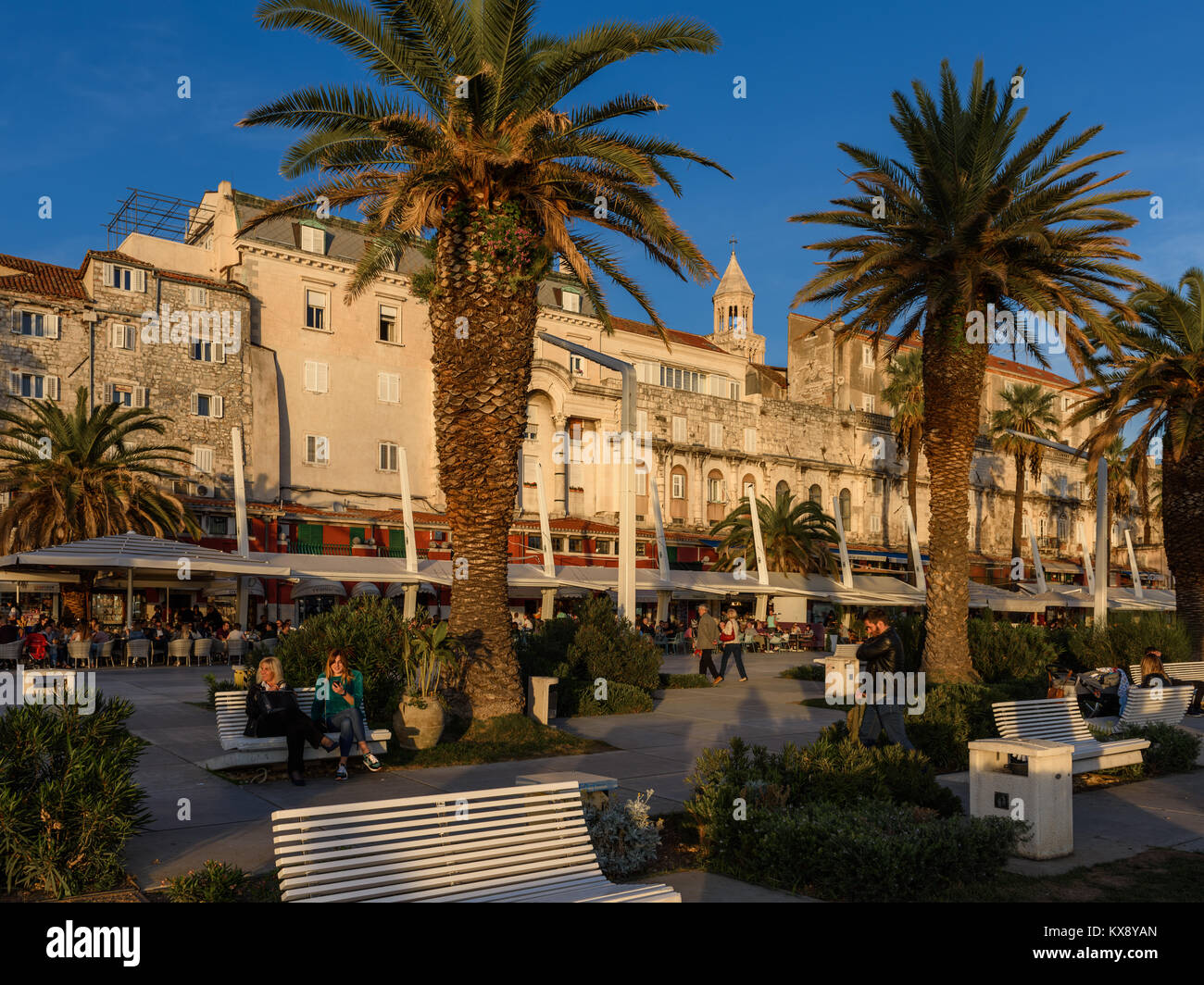 Tourists and locals enjoying Riva promenade at sunset, Split, Croatia ...