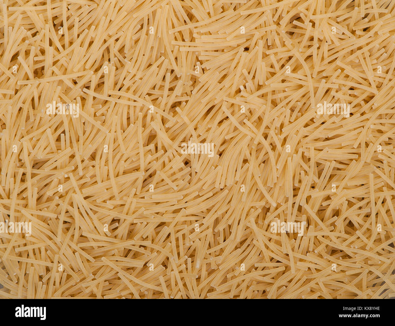 Raw vermicelli pasta texture background Stock Photo - Alamy