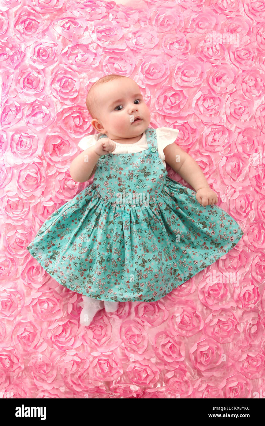 baby girl playing on rug, child development and play Stock Photo - Alamy