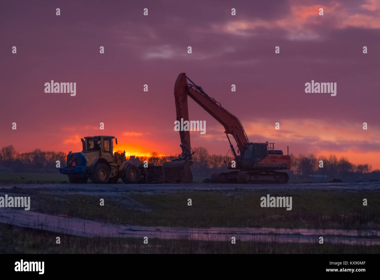 construction work with heavy machines and a bulldozer Stock Photo - Alamy