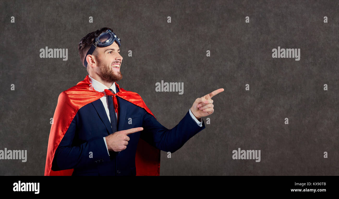 A man in a superhero costume points his finger Stock Photo - Alamy