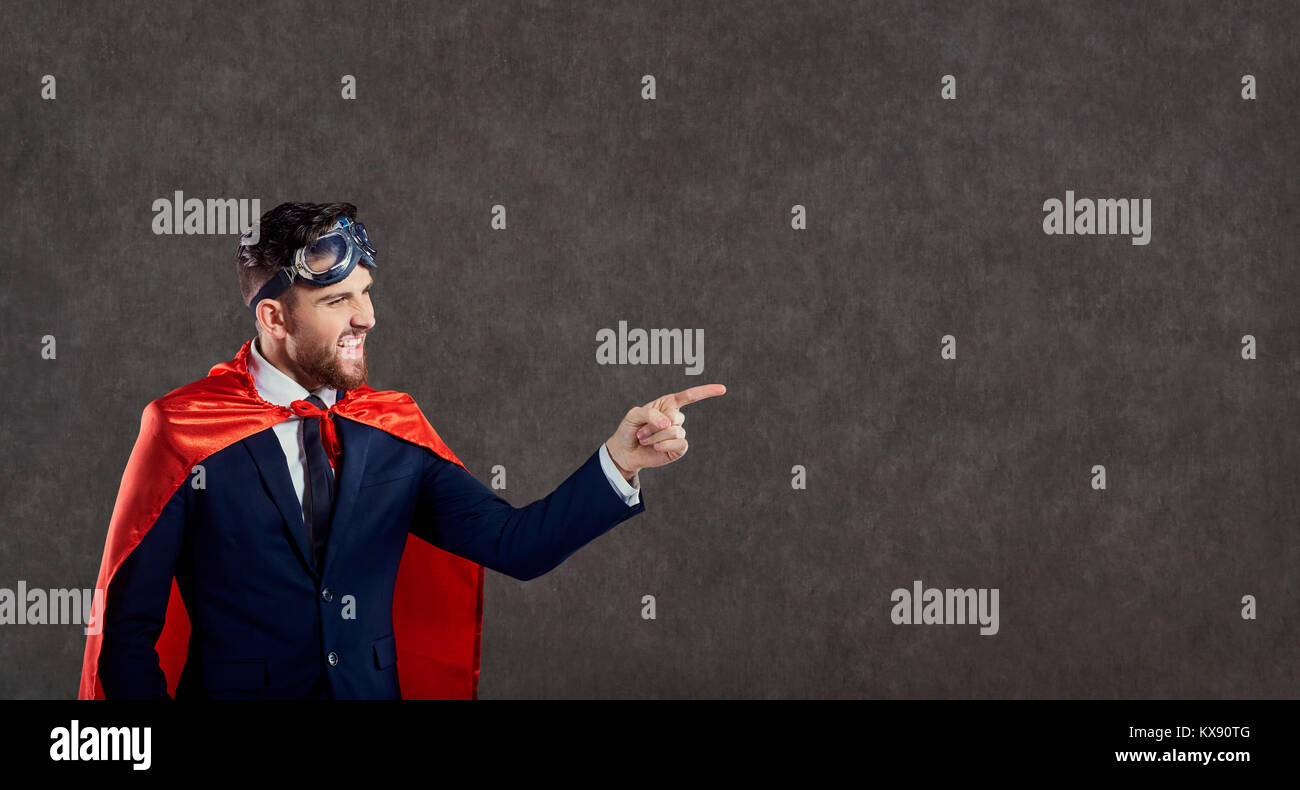 A man in a superhero costume points his finger Stock Photo - Alamy