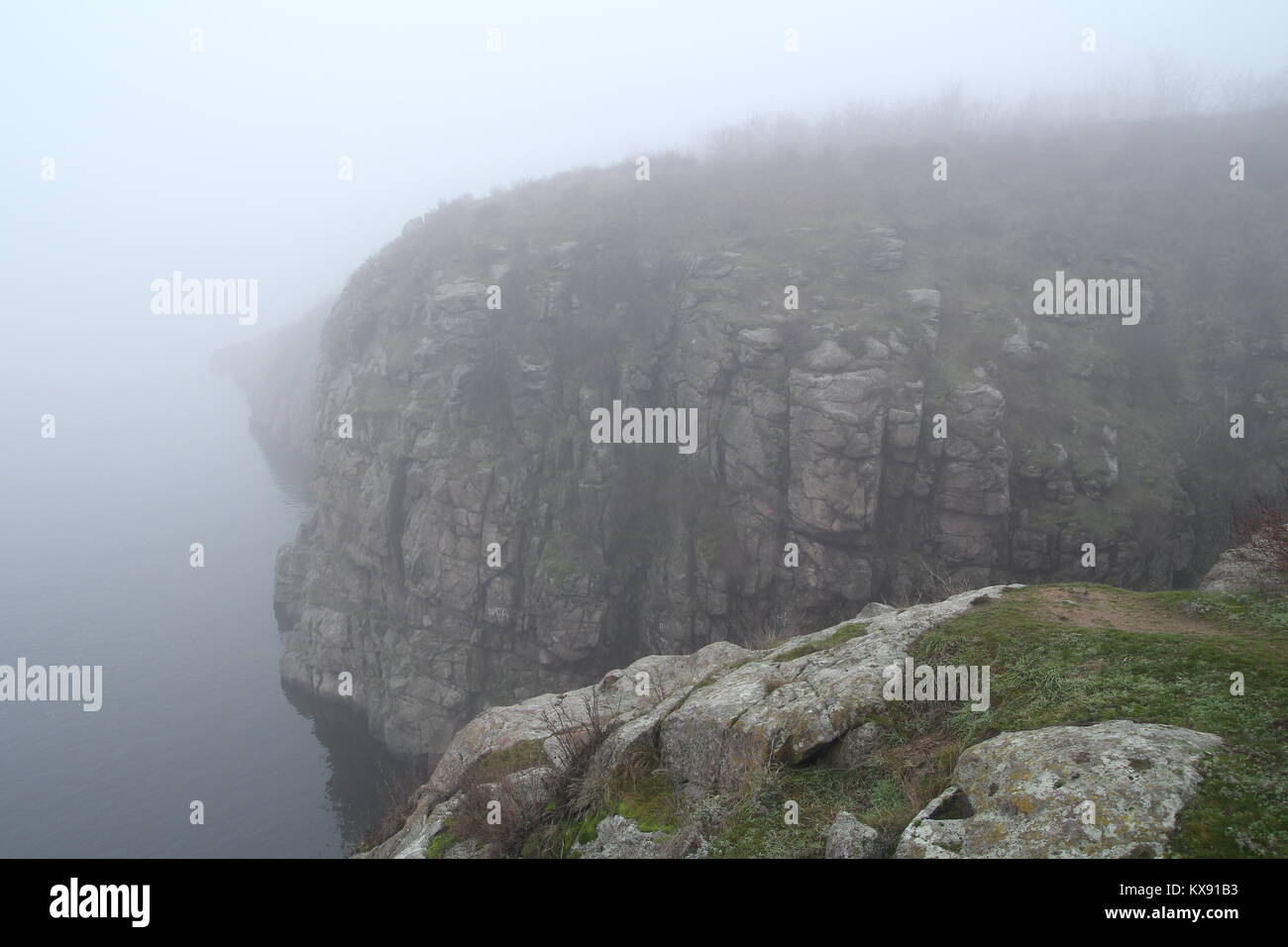 Dense fog and rocks Stock Photo - Alamy