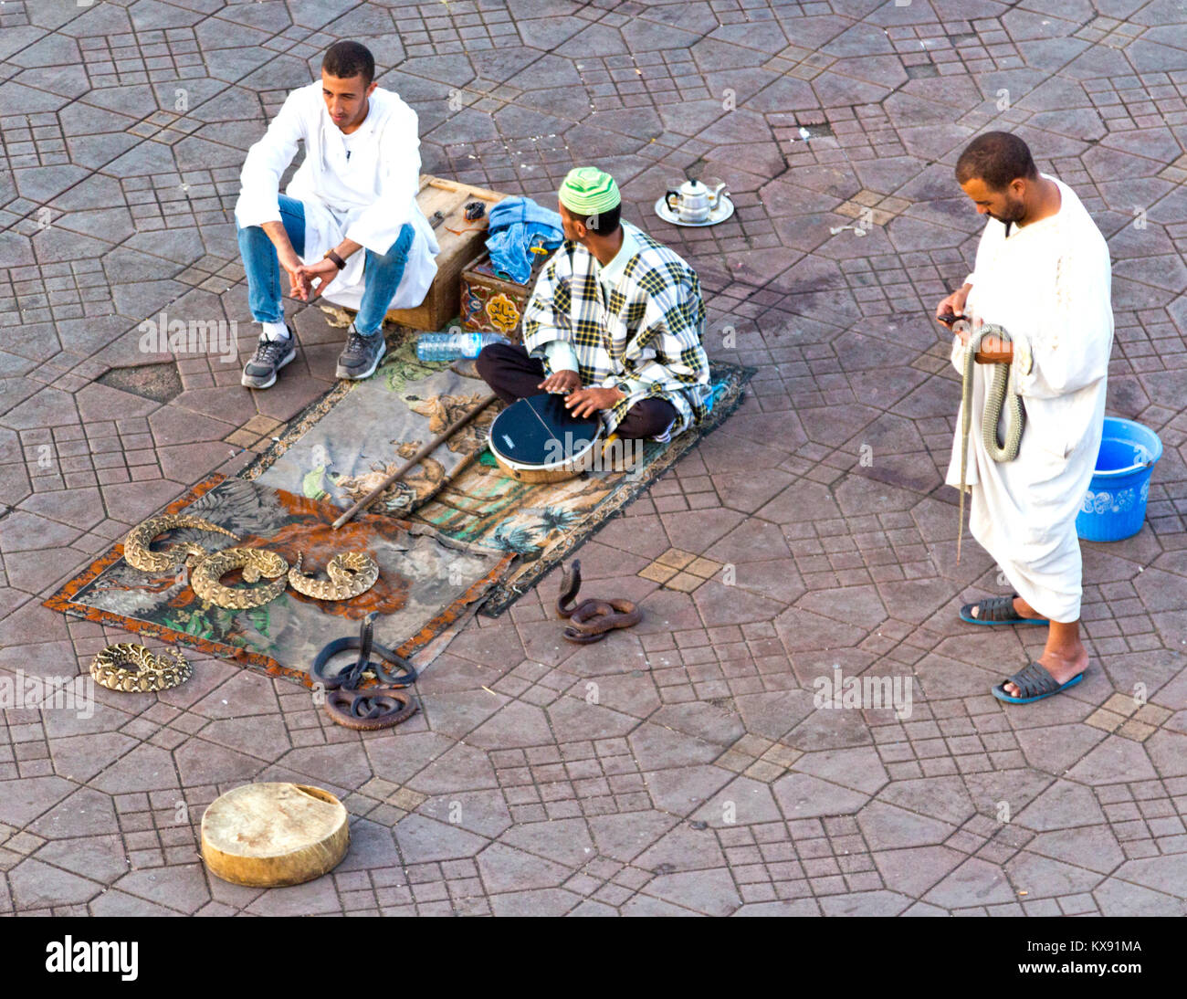 Snake charmers on the Djemaa el Fna market square in Marrakesh, Morocco ...