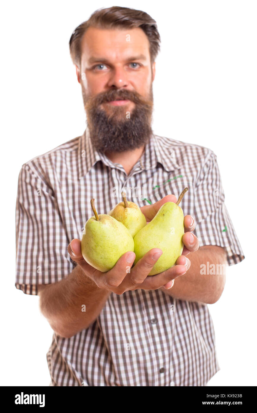 Portrait of bearded man holding pears against white background Stock ...