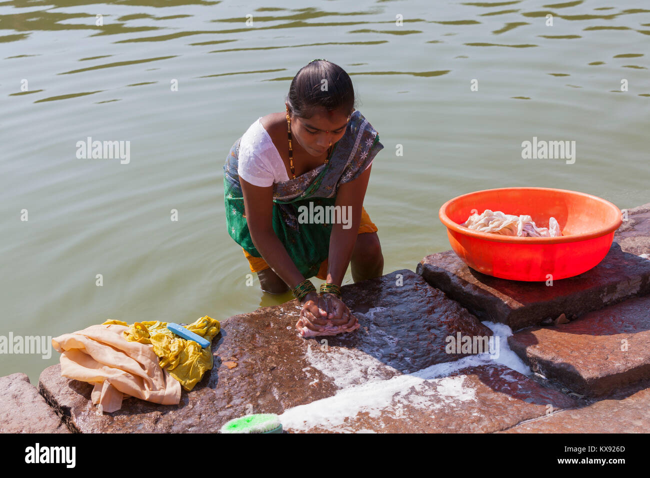 Indian Women Washing Clothes High Resolution Stock Photography and ...